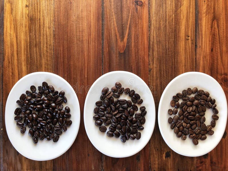 Touch the Difference . Different of Coffee Beans Roasts Stock Photo ...
