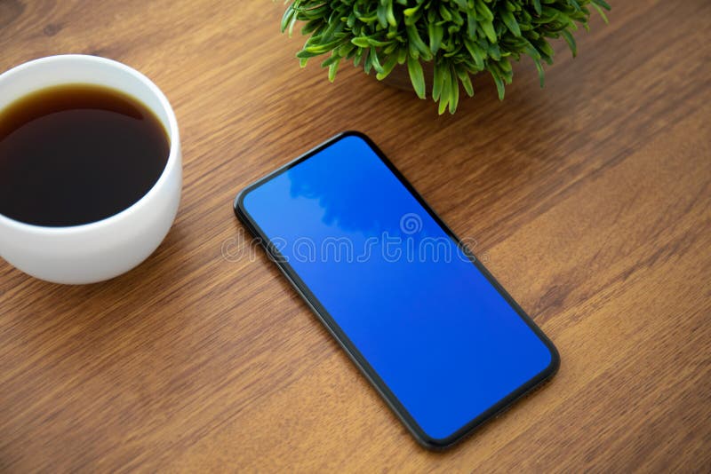 Touch Phone with Blue Screen on the Table in Office Stock Photo - Image ...