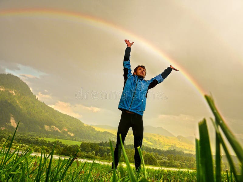 Touch a Rainbow, Joyful Hiker Reaching for the Rainbow in Lush Valley ...