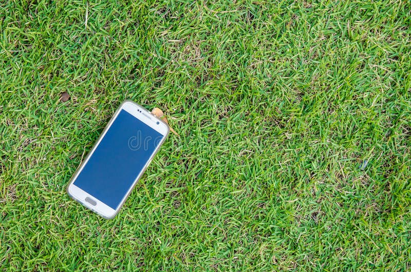 Touch Screen Smart Phone on the Field of Grass Stock Photo - Image of ...