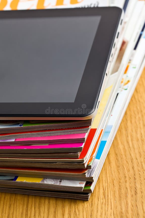 Touch tablet and magazines stock photo. Image of magazine - 30044042