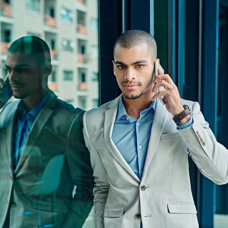 Touching Base with a Client. Portrait of a Young Businessman Using His ...