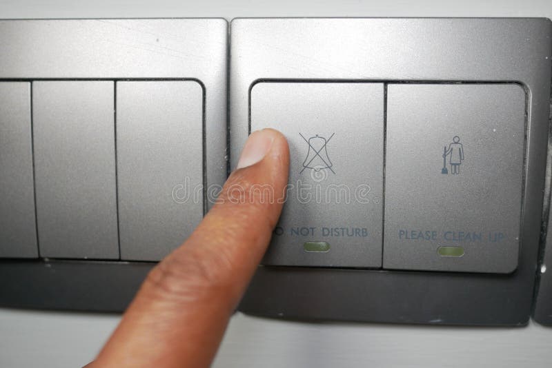 Touching the Do Not Disturb Button in a Hotel Room Stock Photo - Image ...