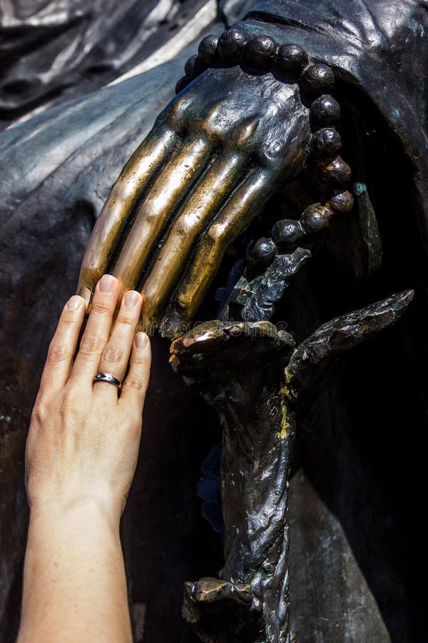 Touching a Saint stock image. Image of woman, spring - 164113585