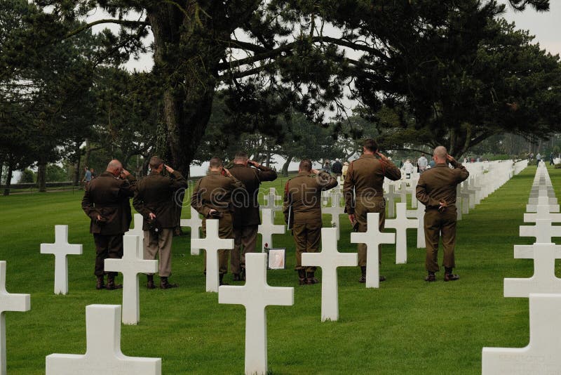 Touching View of Men in Uniform Saluting in the Normandy American ...