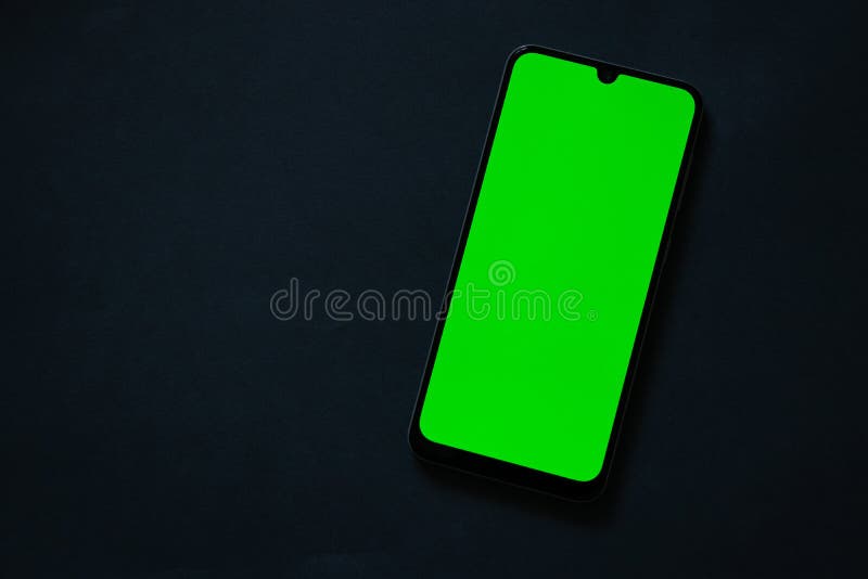 Touchscreen Phone with Green Screen on a Wooden Table Stock Image ...