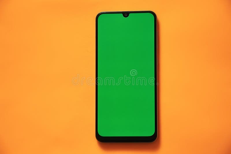 Touchscreen Phone with Green Screen on a Wooden Table Stock Image ...