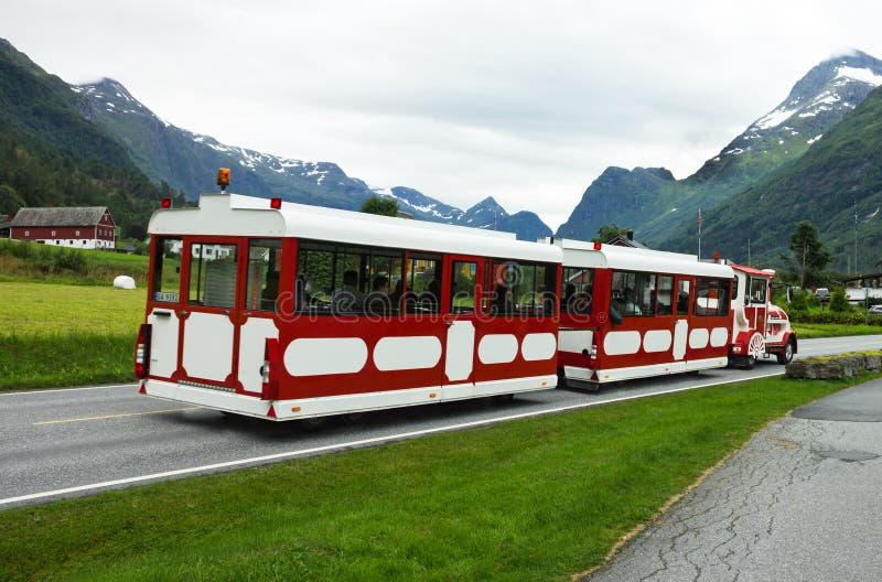 Tour bus in town Olden editorial photo. Image of norway - 30000326