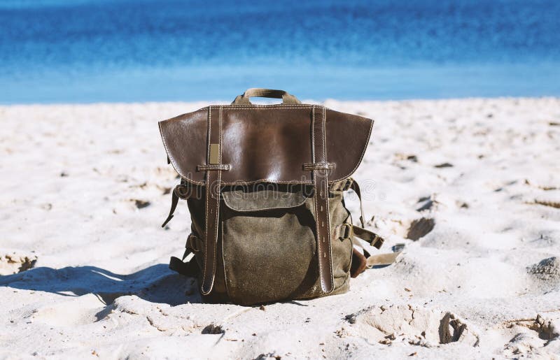 Backpack on the beach stock photo. Image of summer, travel - 340853878