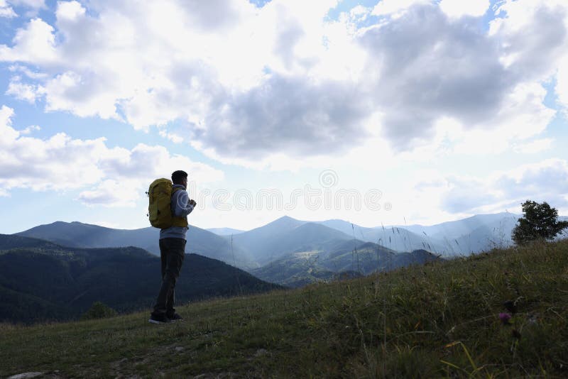 Tourist with Backpack Enjoying Mountain Landscape, Space for Text Stock ...