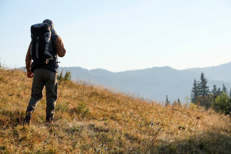 Tourist with Backpack in Mountains, Back View. Space for Text Stock ...