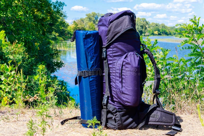 Tourist Backpack Near a River at Summer. Hike Concept Stock Image ...