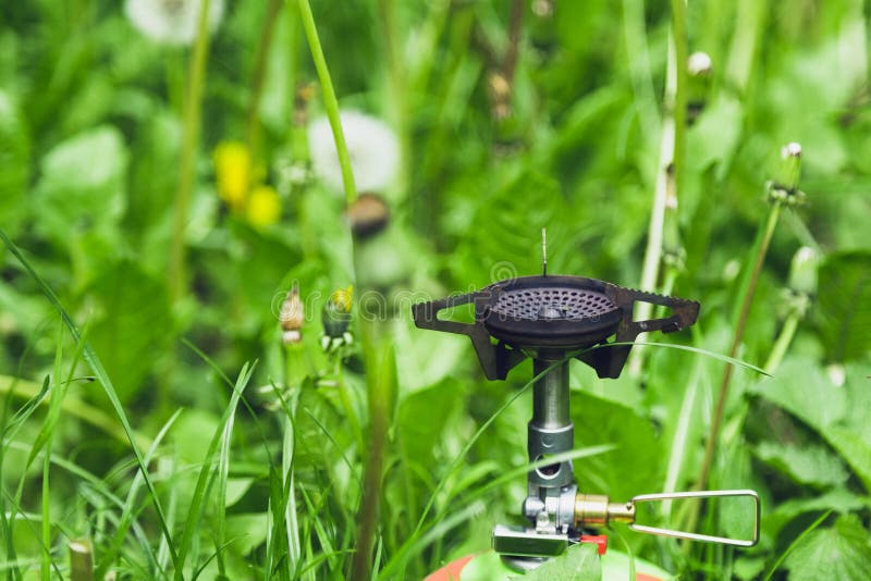 Tourist Burner on a Gas Cylinder in the Grass. Stock Photo - Image of ...