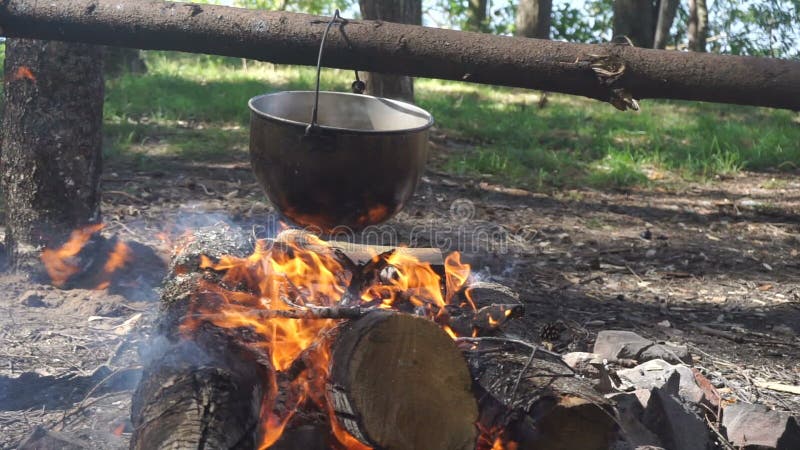 Campfire Cooking: Pot of Soup Simmering Over Open Fire Stock Video ...