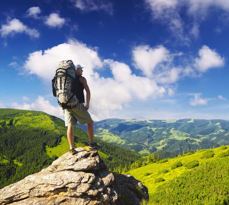 Tourist on the High Rocks Background. Sport and Active Life Concept ...