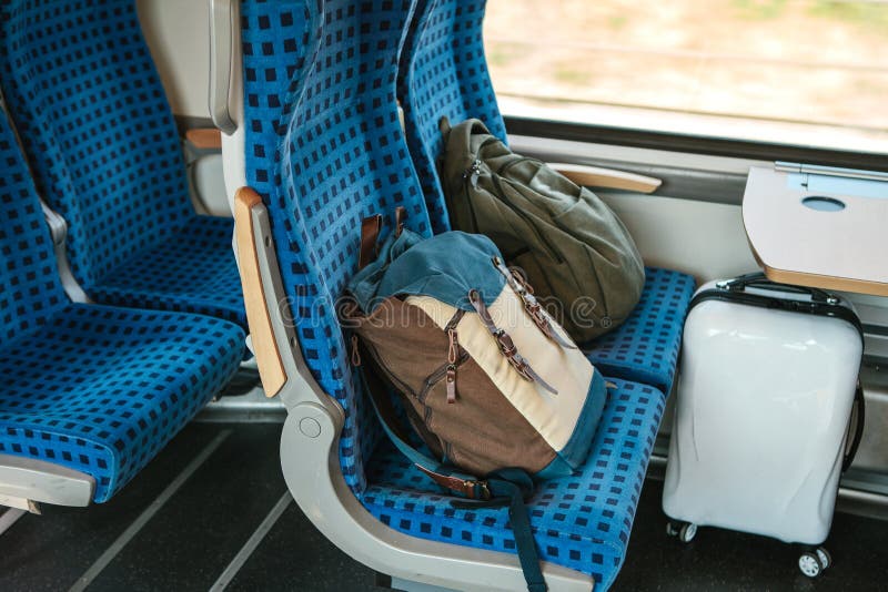 Two Backpacks on the Seats in the Train Stock Image - Image of space ...