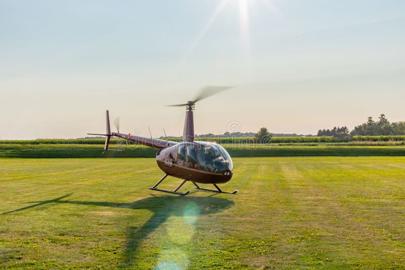 Tourist Helicopter Ride Taking Off from Field Stock Photo - Image of ...