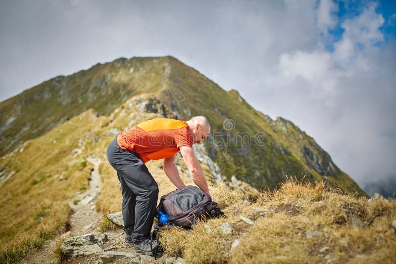 Tourist hiking with camera stock image. Image of backpacker - 158634149