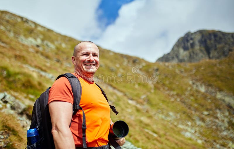 Tourist hiking with camera stock image. Image of outside - 158634191