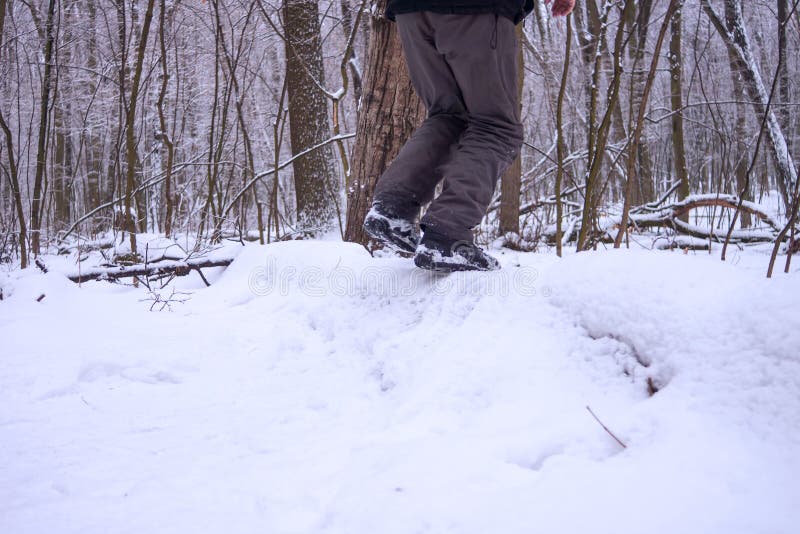 Tourist Jumps Over a Log in the Winter Forest Stock Photo - Image of ...