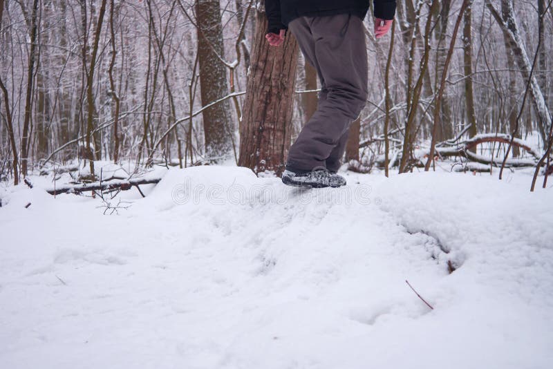 Tourist Jumps Over a Log in the Winter Forest Stock Photo - Image of ...