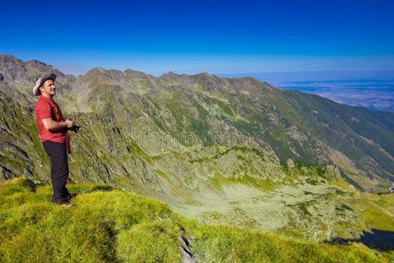 Tourist Looking at View and Taking Photos Stock Image - Image of rock ...