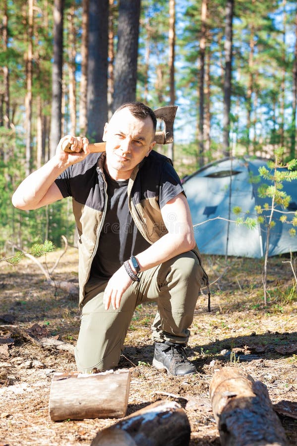 Tourist Man Chops Tree in Forest with Sharp Ax Stock Image - Image of ...
