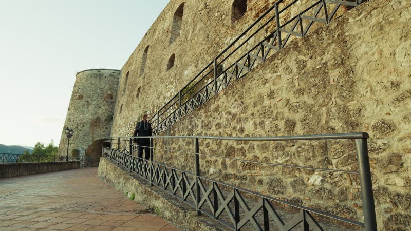 Tourist Man Explores an Ancient Rural Defensive Castle Stock Video ...