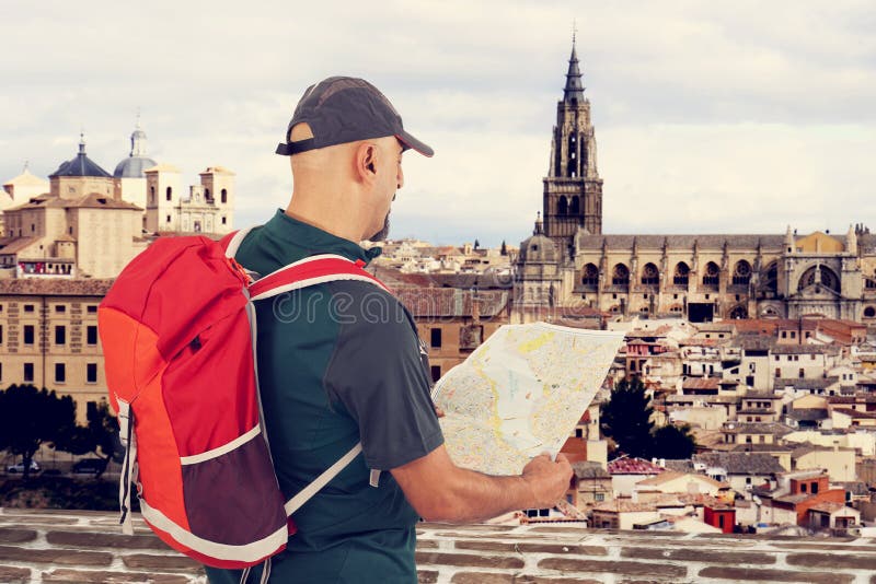 Tourist man looking map stock photo. Image of person - 59853616