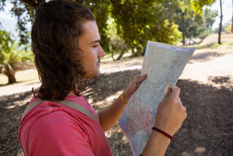 Tourist Man Looking at Map in the Park Stock Photo - Image of casual ...