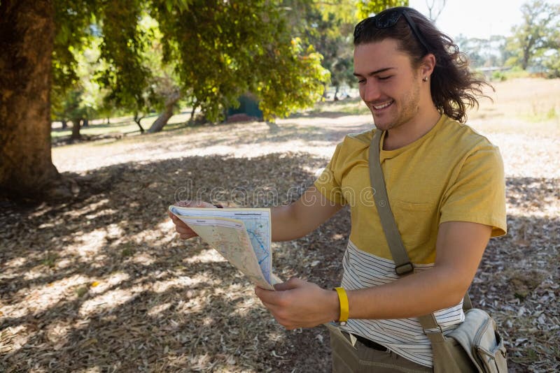 Tourist Man Looking at Map in the Park Stock Image - Image of handsome ...