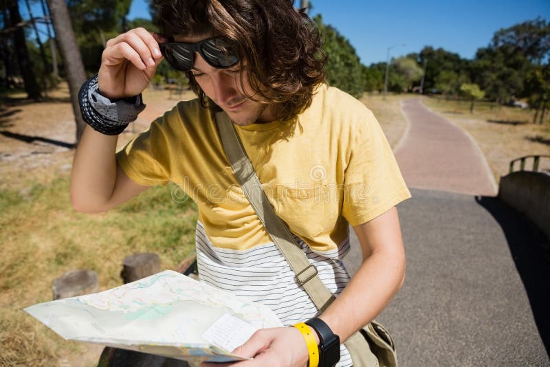 Tourist Man Looking at Map in the Park Stock Photo - Image of ...