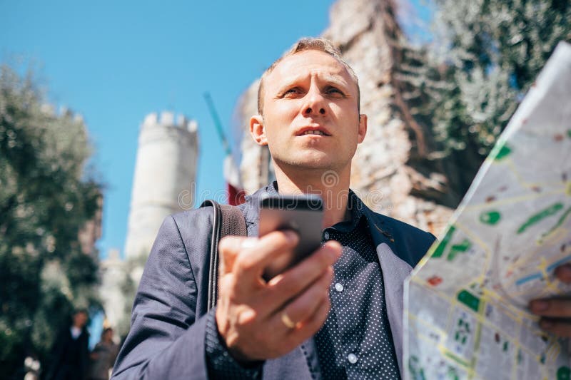 Tourist Man Try Navigate Himself with Map and Smartphone in Unknown ...