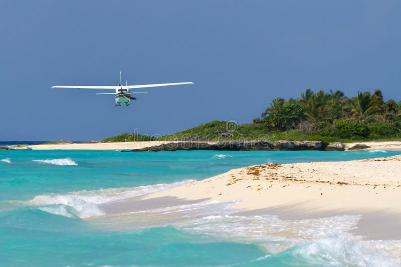 Tourist Plane Flying Over Caribbean Beach Stock Photo - Image of travel ...