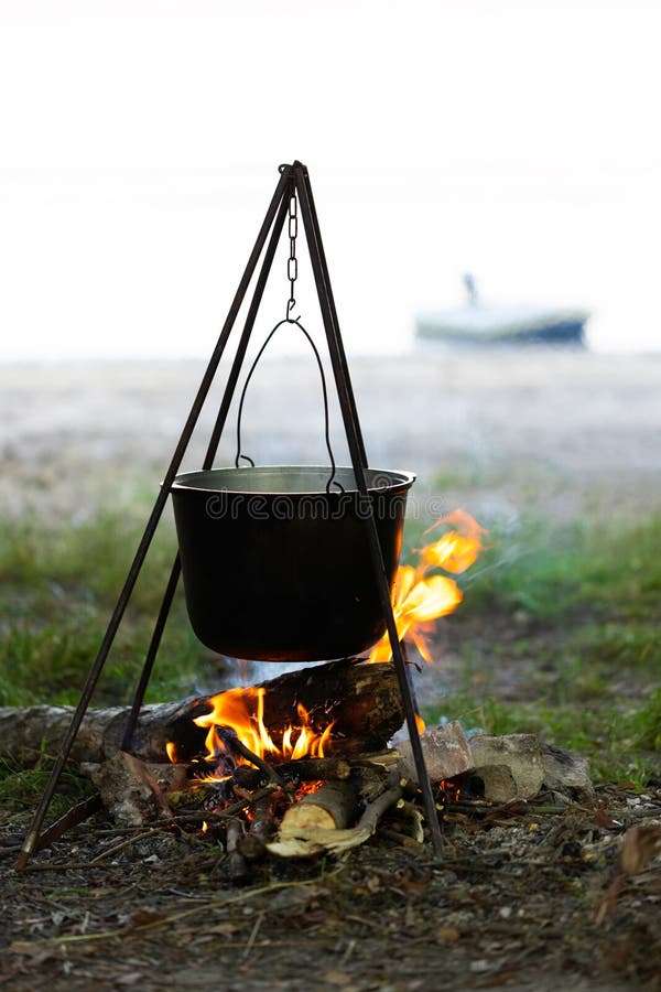 Tourist Pot Hanging Over the Fire on a Tripod. Cooking in the Campaign ...