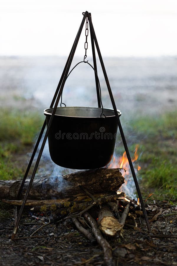 Tourist Pot Hanging Over the Fire on a Tripod. Cooking in the Campaign ...