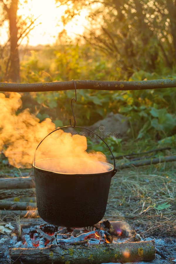 Tourist pot over camp fire stock photo. Image of fire - 85781894