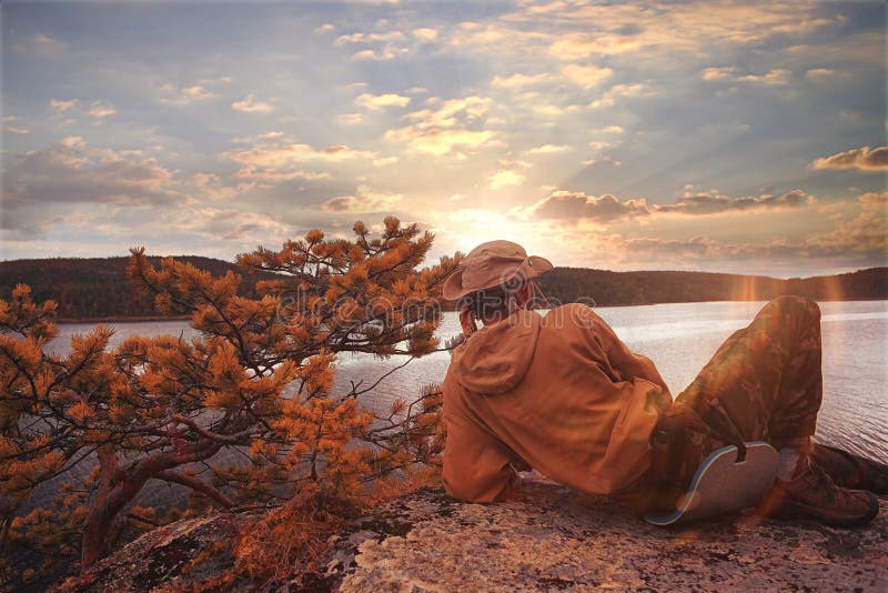 Tourist Resting in Mountains at Sunset Stock Photo - Image of rest ...