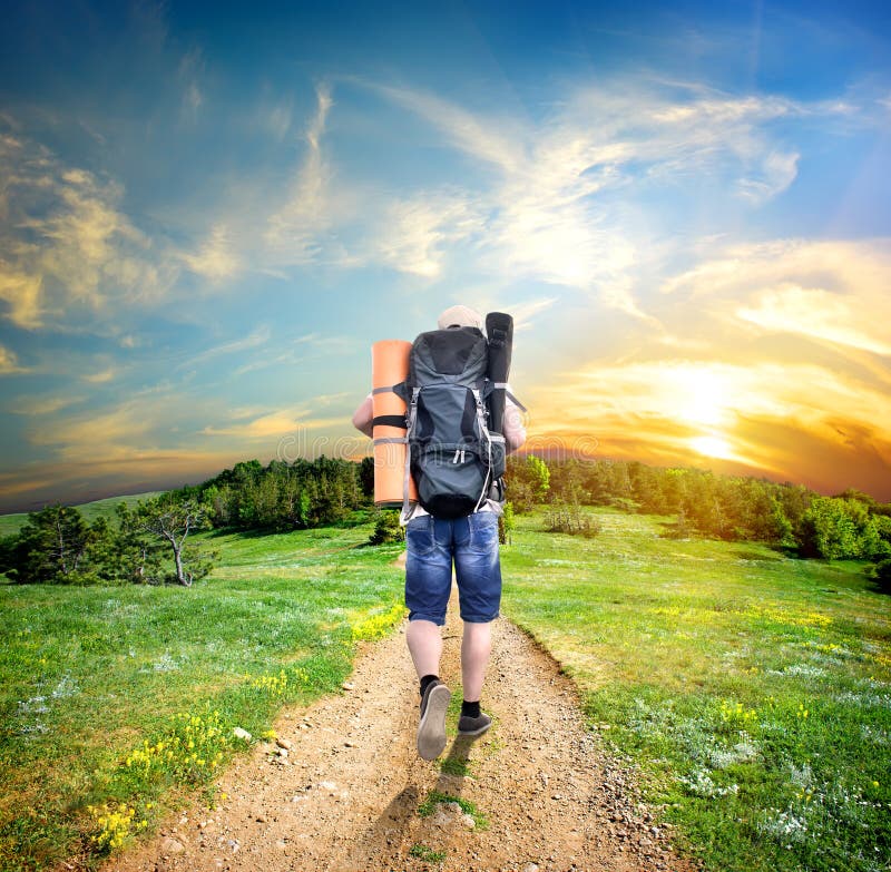 Man Walking Down Country Road Stock Photo - Image of baggage, prairie ...