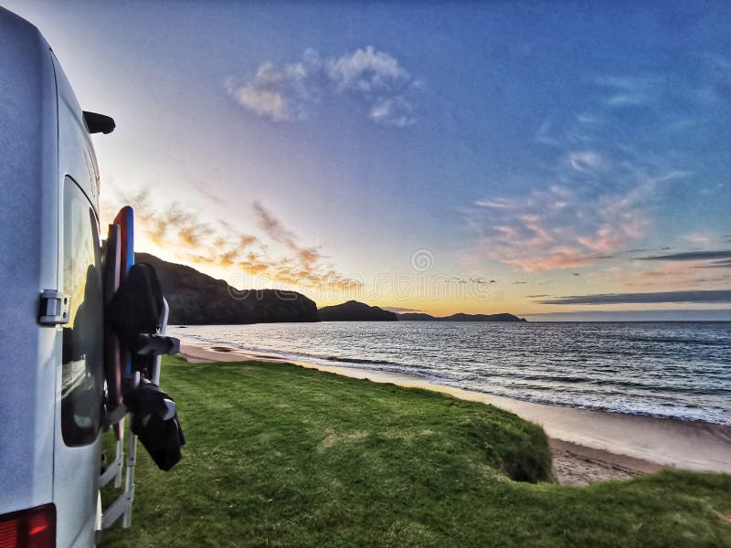 Tourist S Campervan RV on an Ocean Beach at Sunset Stock Photo - Image ...