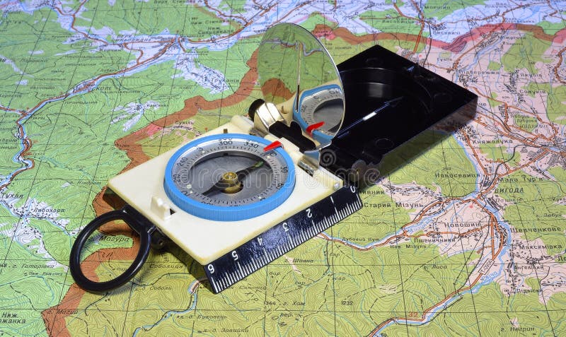 Tourist s compass at map stock photo. Image of tourists - 34964704