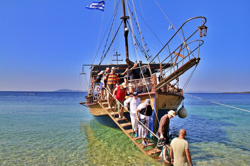 A Tourist Ship, a Tourist Ship, Tourists Getting Off the Ship at the ...