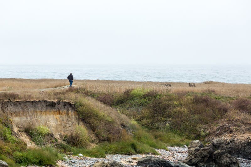 Tourist strolling a path stock photo. Image of surf - 126347016