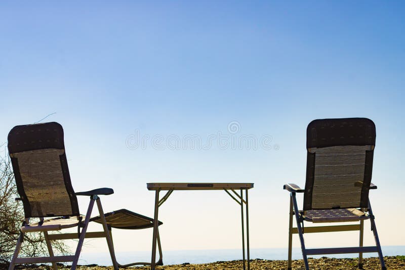 Tourist Table and Chairs on Coast Stock Image - Image of camping, cliff ...