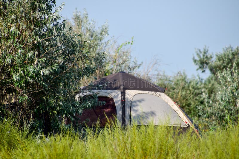 Tourist Tent Under a Tree. Tourist Camping Stock Photo - Image of ...