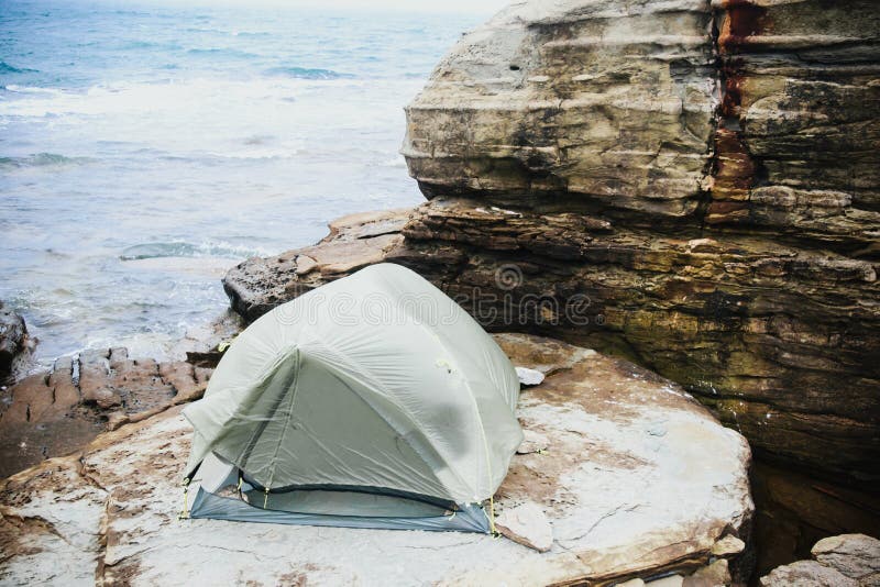 Tourist Tent in the Wild on a Stone Cliff by the Sea Stock Photo ...