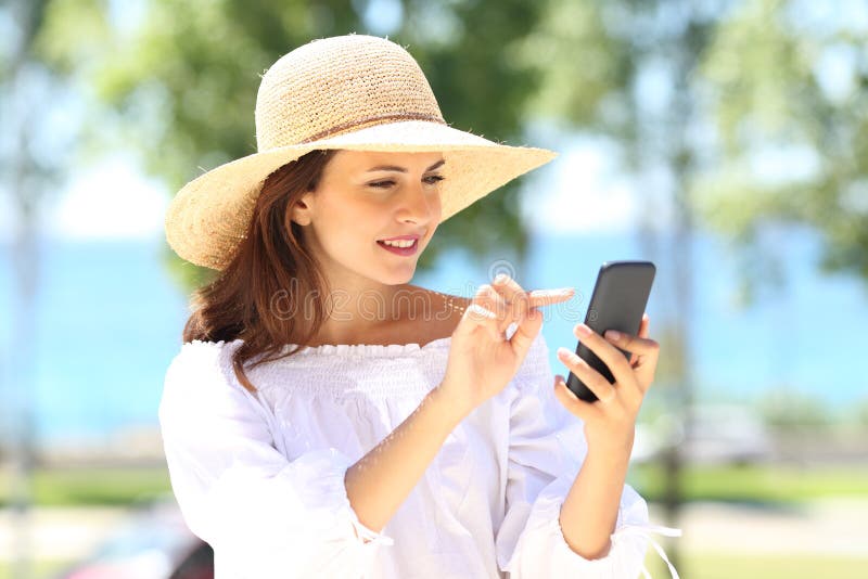 Tourist Using Smart Phone on the Beach on Holiday Stock Image - Image ...