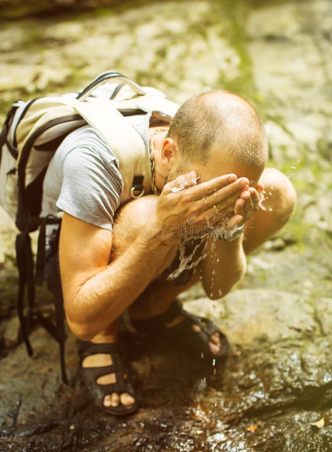 Tourist Washing Hands in a Mountain River Stock Photo - Image of health ...