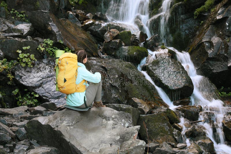 Tourist with Yellow Backpack Enjoying Mountain Waterfall Stock Image ...