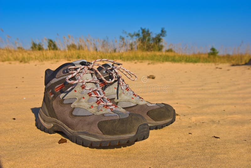 Touristic boots on a sand stock image. Image of friable - 18489357